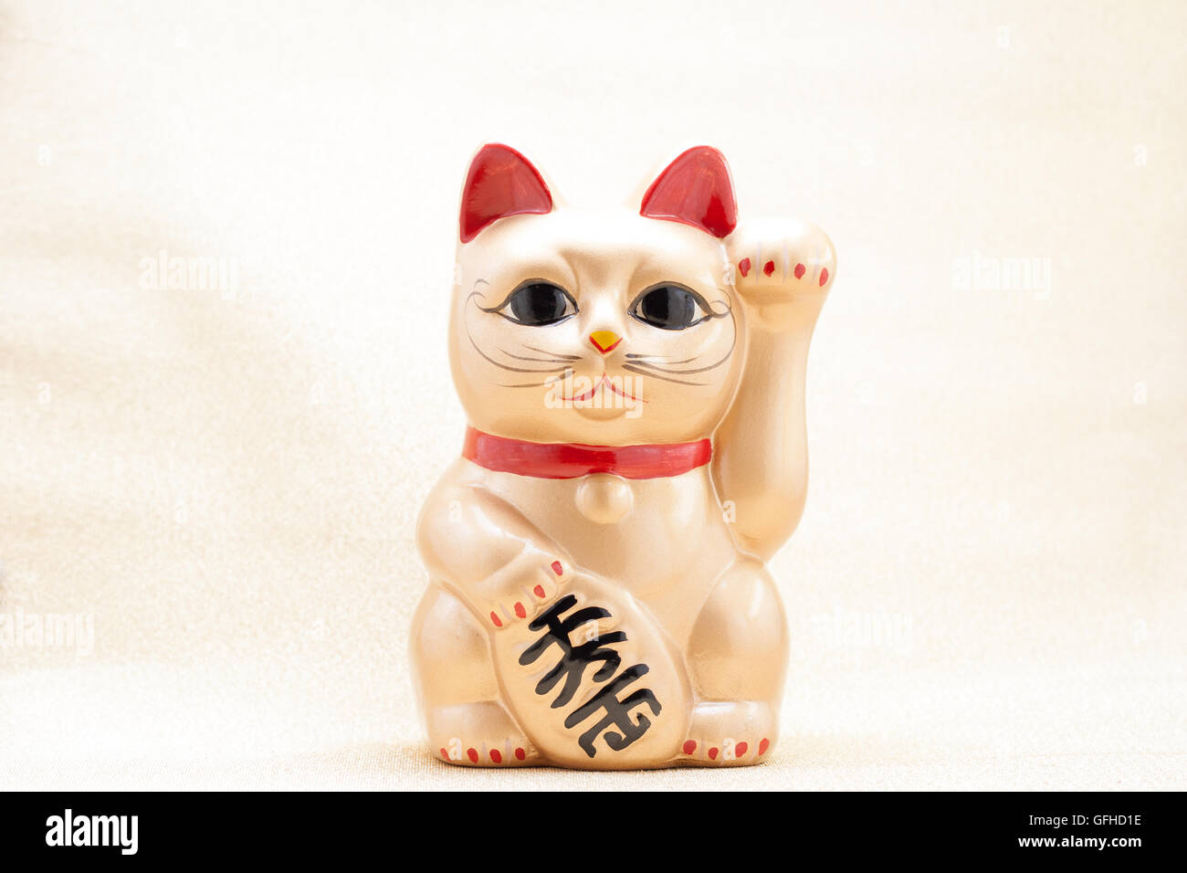 Japanese golden beckoning cat called Manekineko also known as a lucky cat Stock Photo - Alamy
