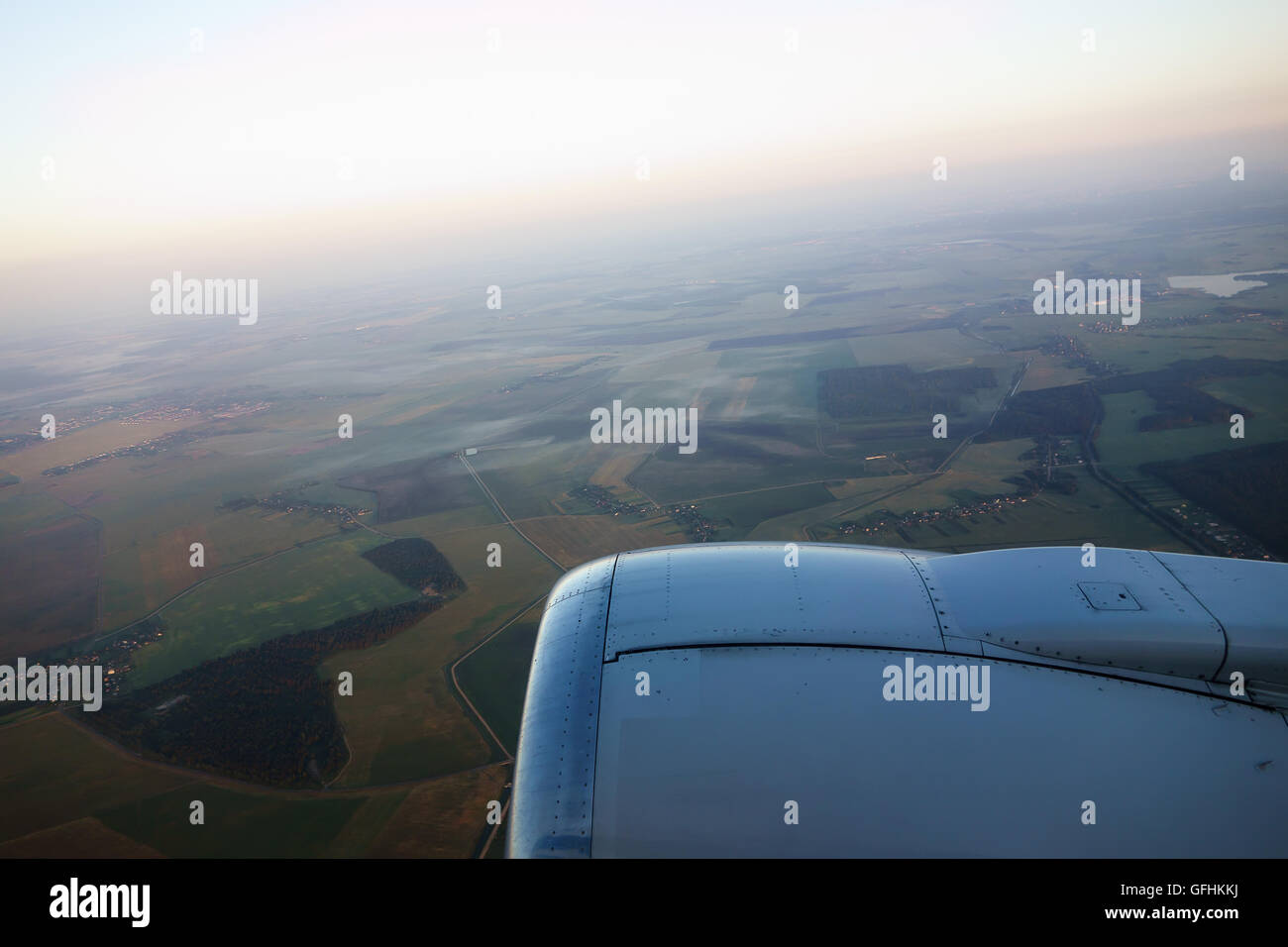view of the earth from the wing of the aircraft gains altitude Stock ...