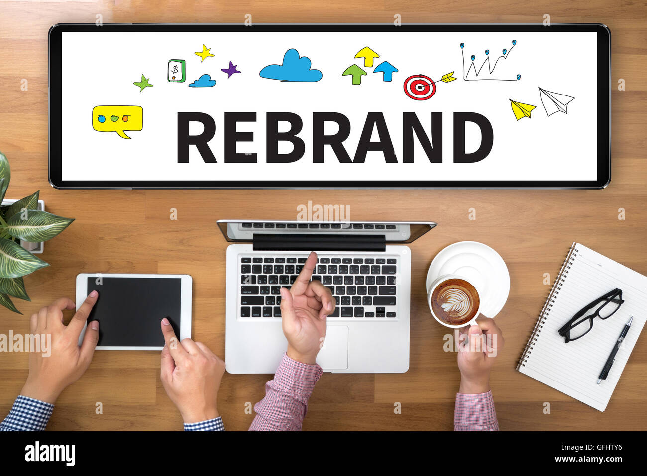 REBRAND Change Identity Branding Two Businessman working at office desk ...