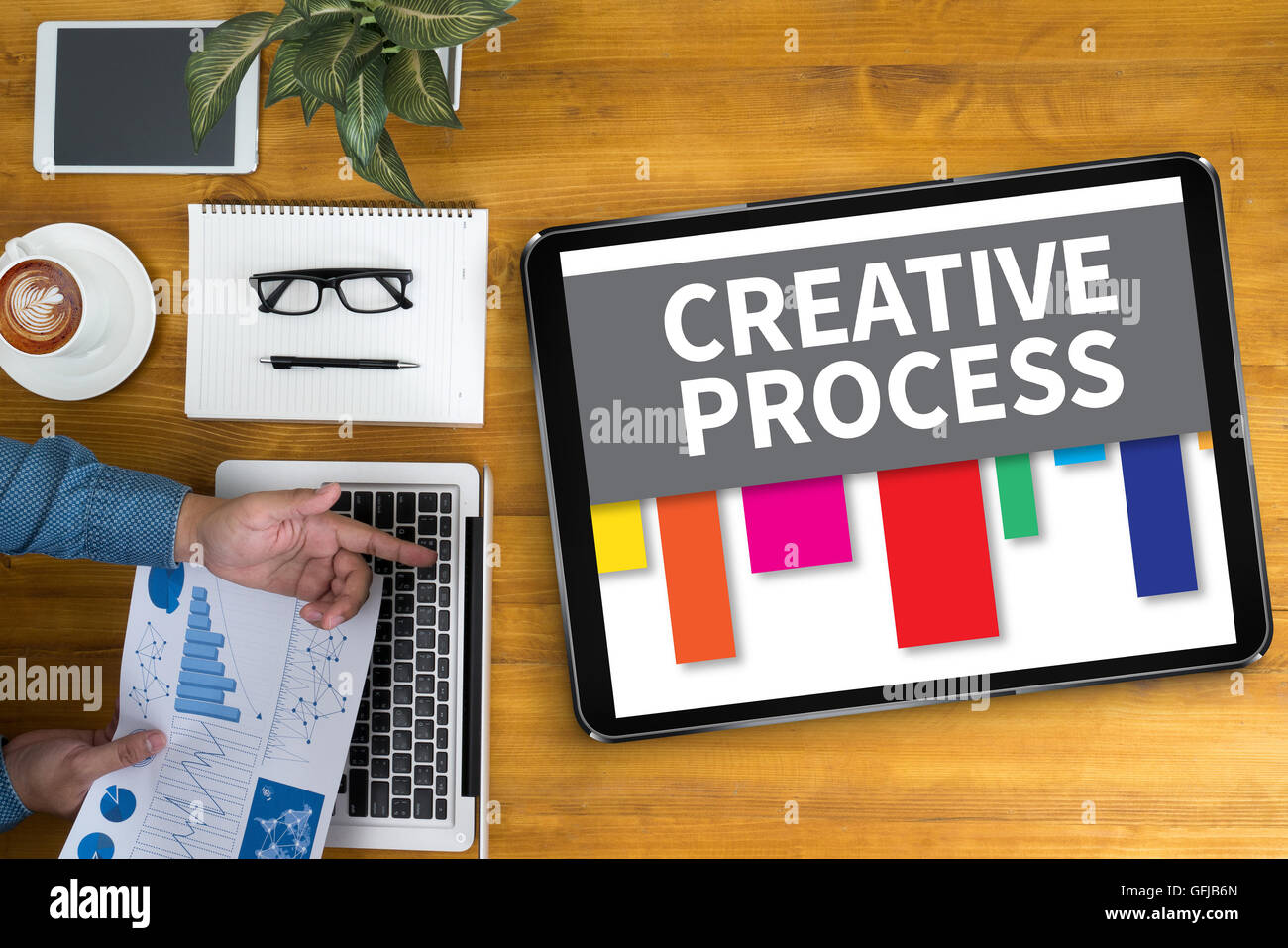 CREATIVE PROCESS Businessman working at office desk and using computer ...