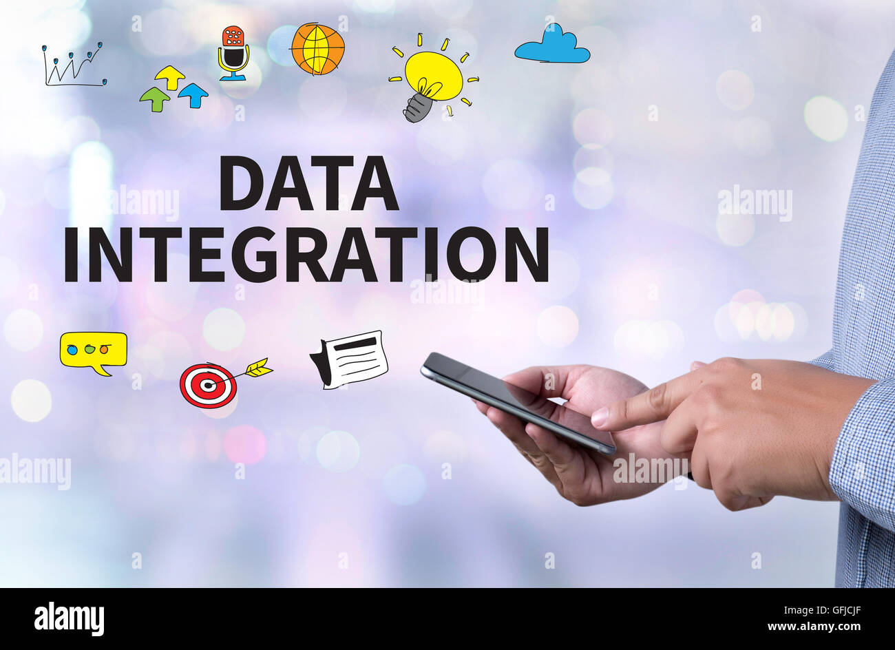 DATA INTEGRATION person holding a smartphone on blurred cityscape ...