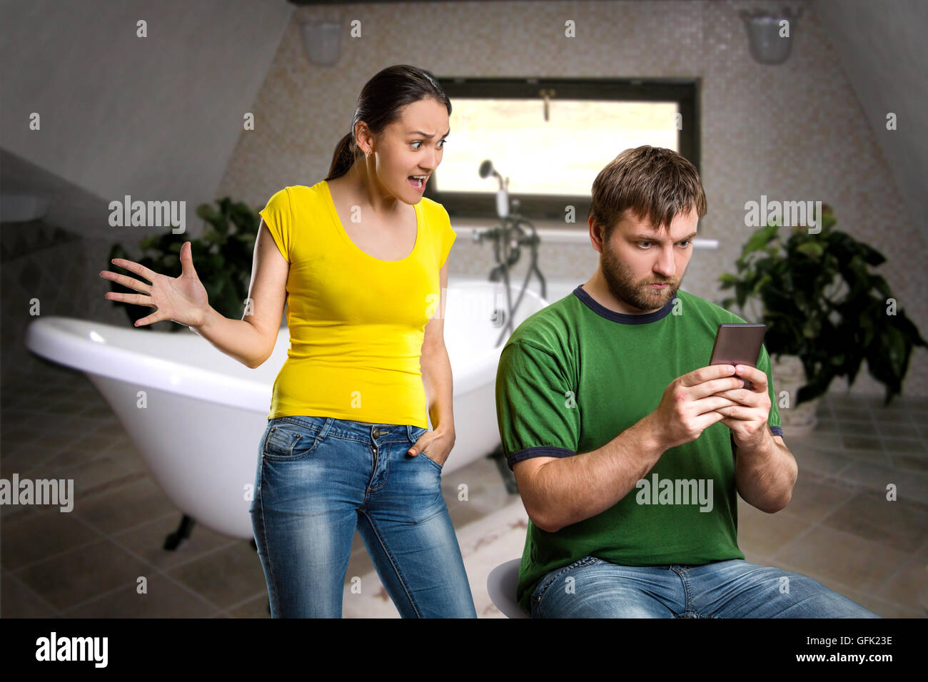 Couple man play with phone hi-res stock photography and images - Alamy