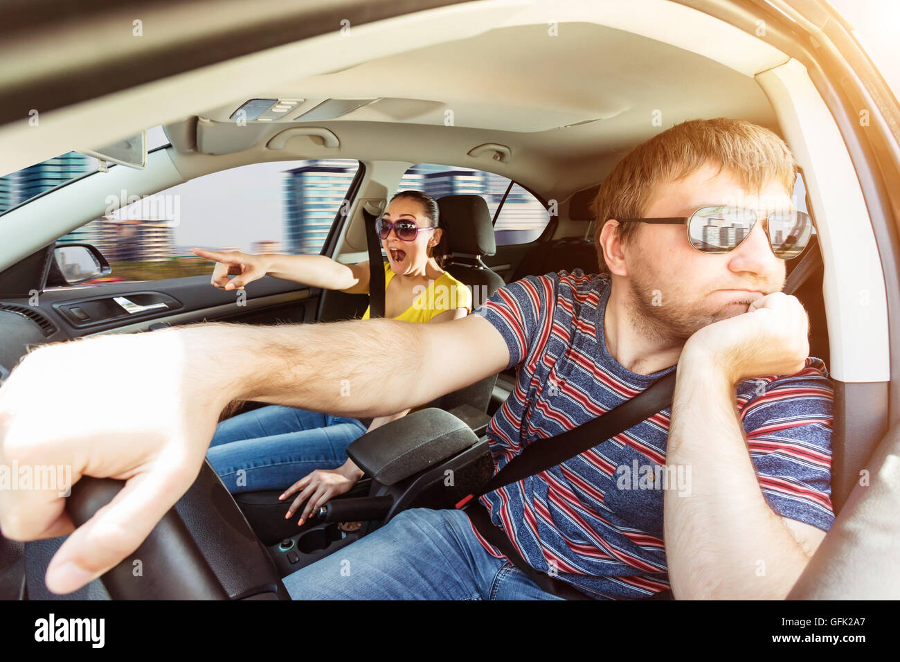 Couple driving in the car Stock Photo - Alamy