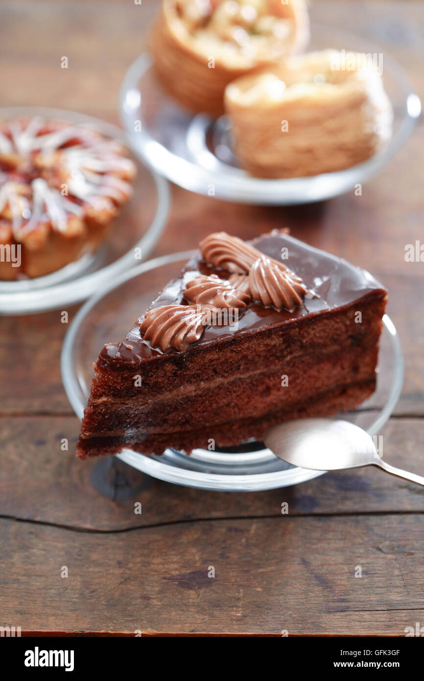 Set of various cakes on nice wooden background Stock Photo - Alamy