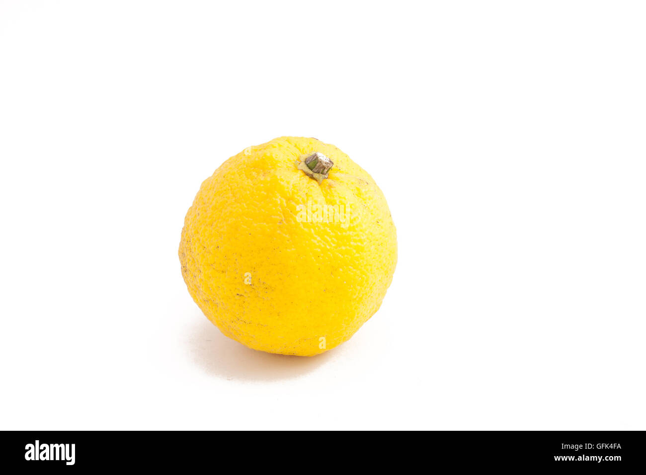 Citron fruit also known as a Yuzu in Japanese on white isolated ...