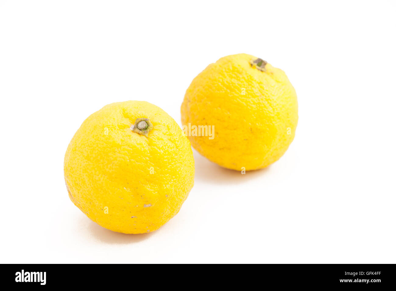 Citron fruit also known as a Yuzu in Japanese on white isolated ...