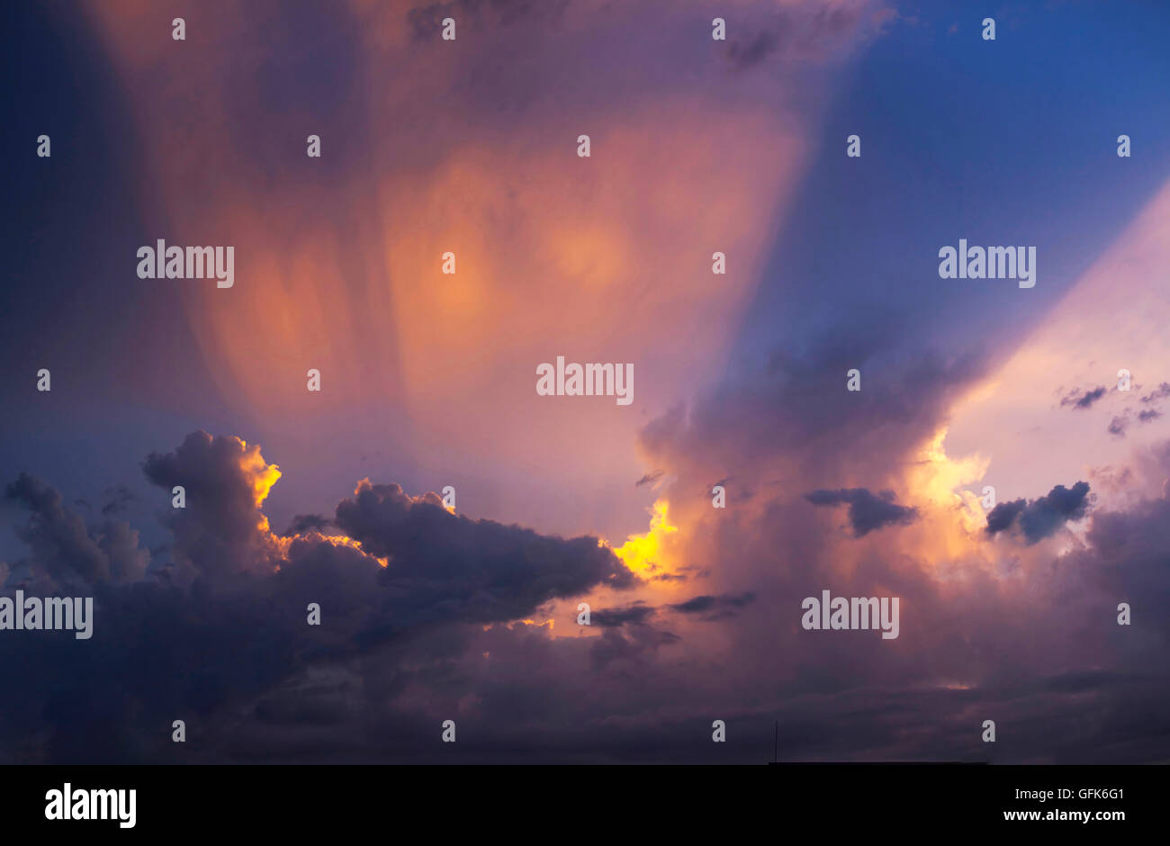 Dramatic sunset sky with orange colored clouds Stock Photo - Alamy