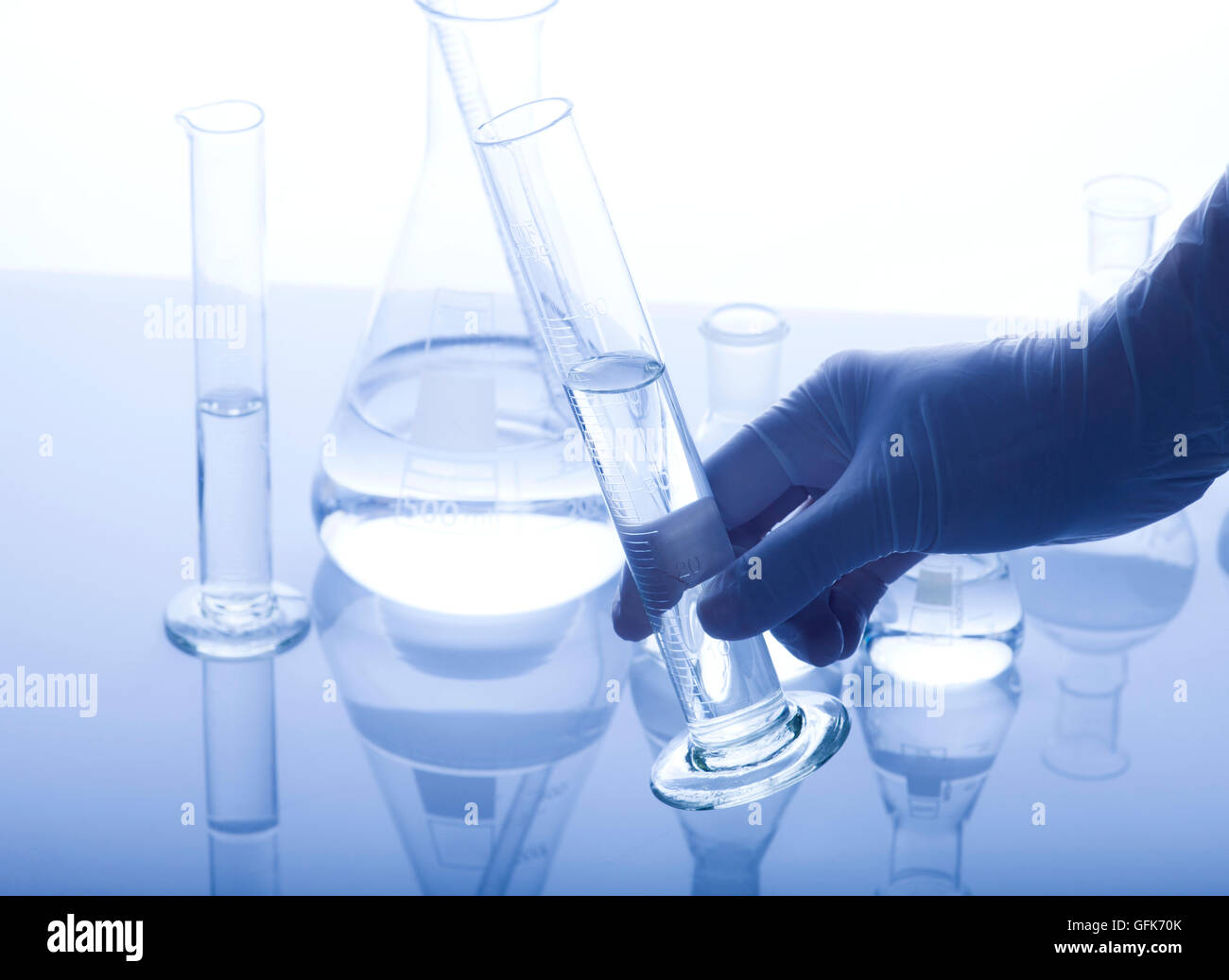 Test-tubes with reflections on a white and blue background. Laboratory ...