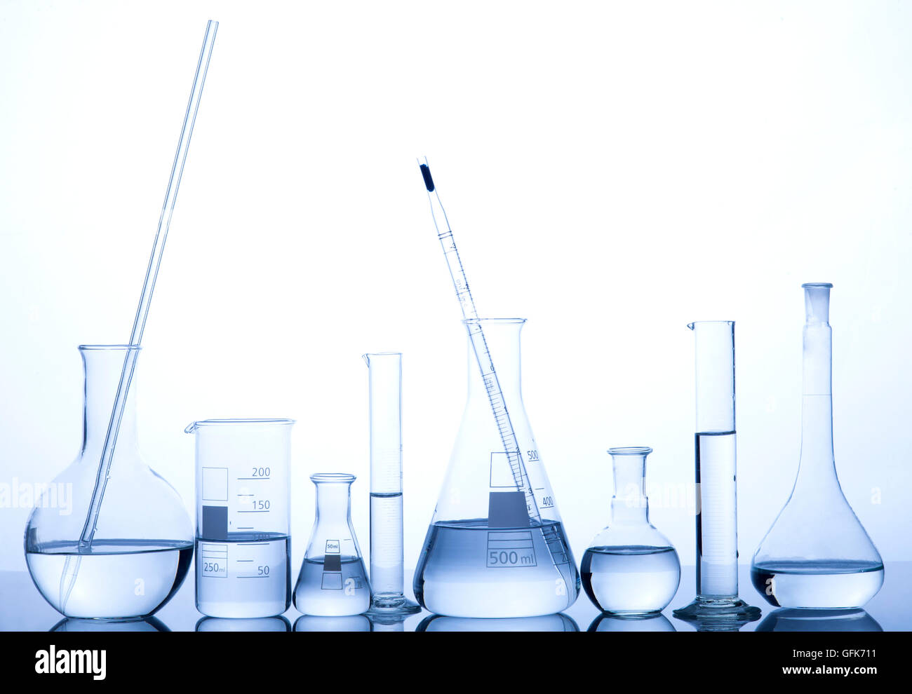 Test-tubes with reflections on a white and blue background. Laboratory ...