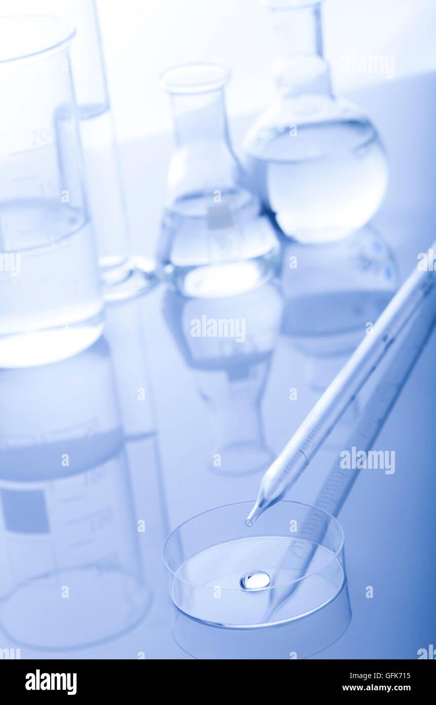 Test-tubes with reflections on a white and blue background. Laboratory ...