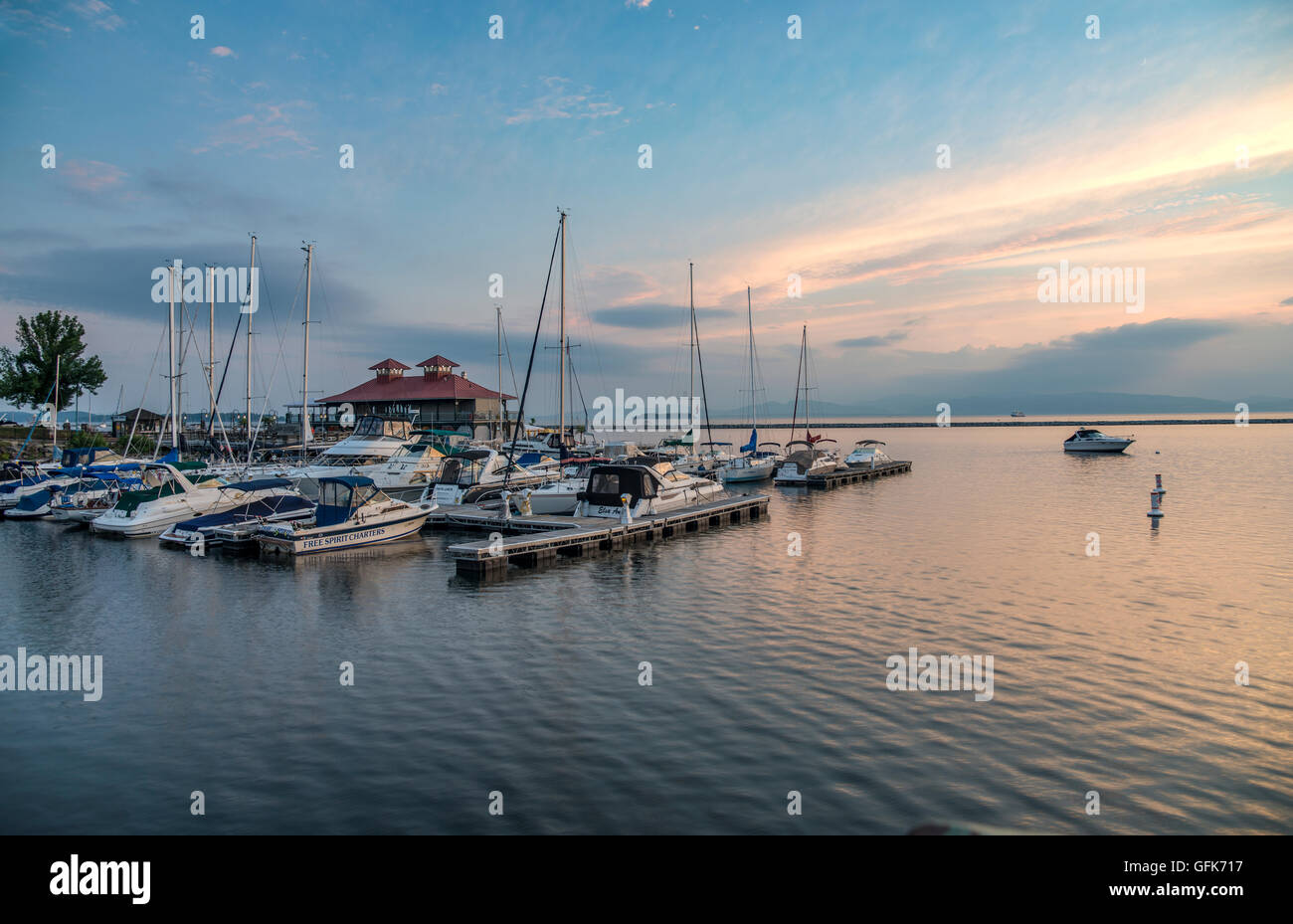 Dusk Scene of Lake Champlain dock Burlington Vermont with boats docked ...