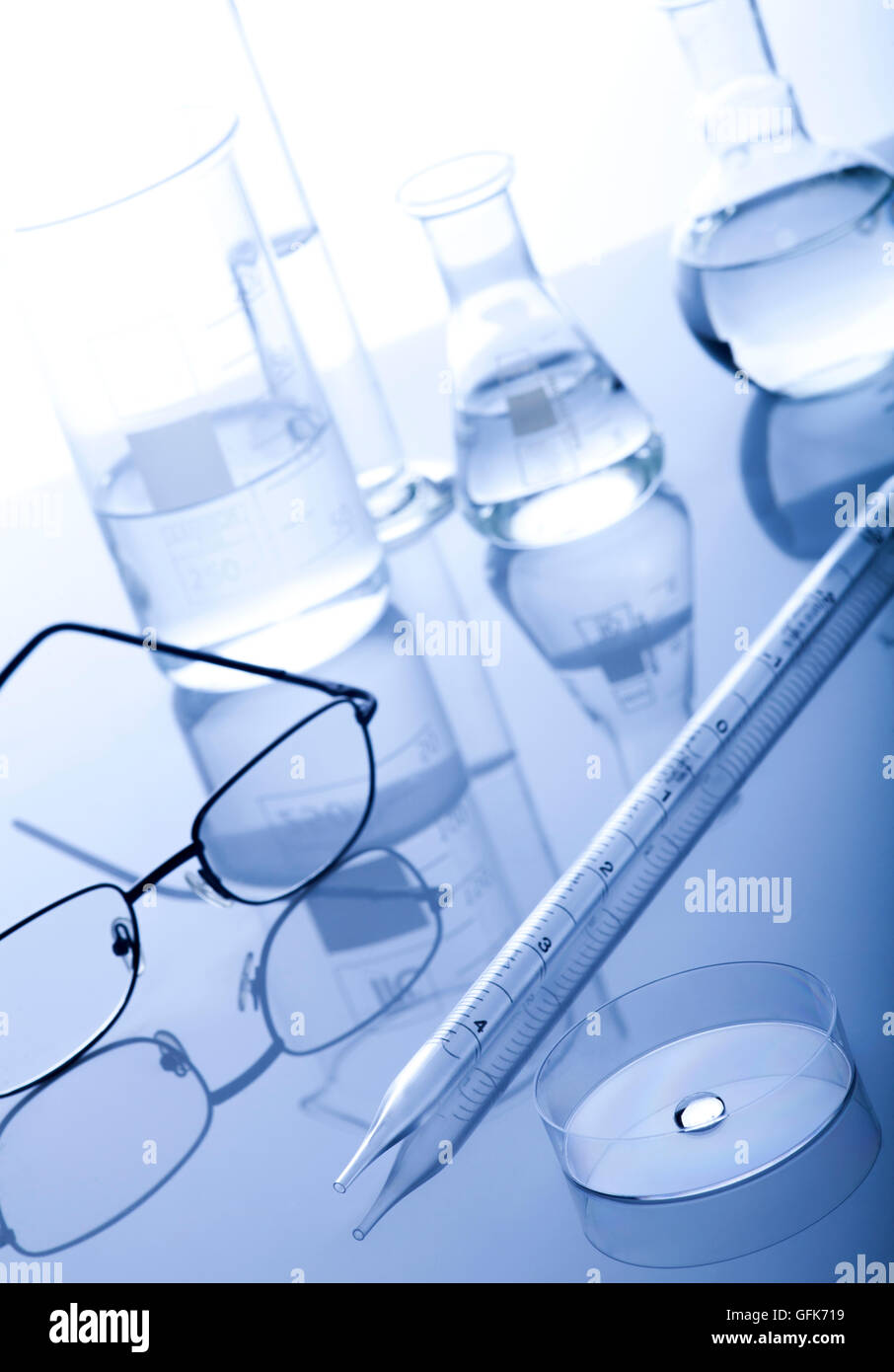 Test-tubes with reflections on a white and blue background. Laboratory ...