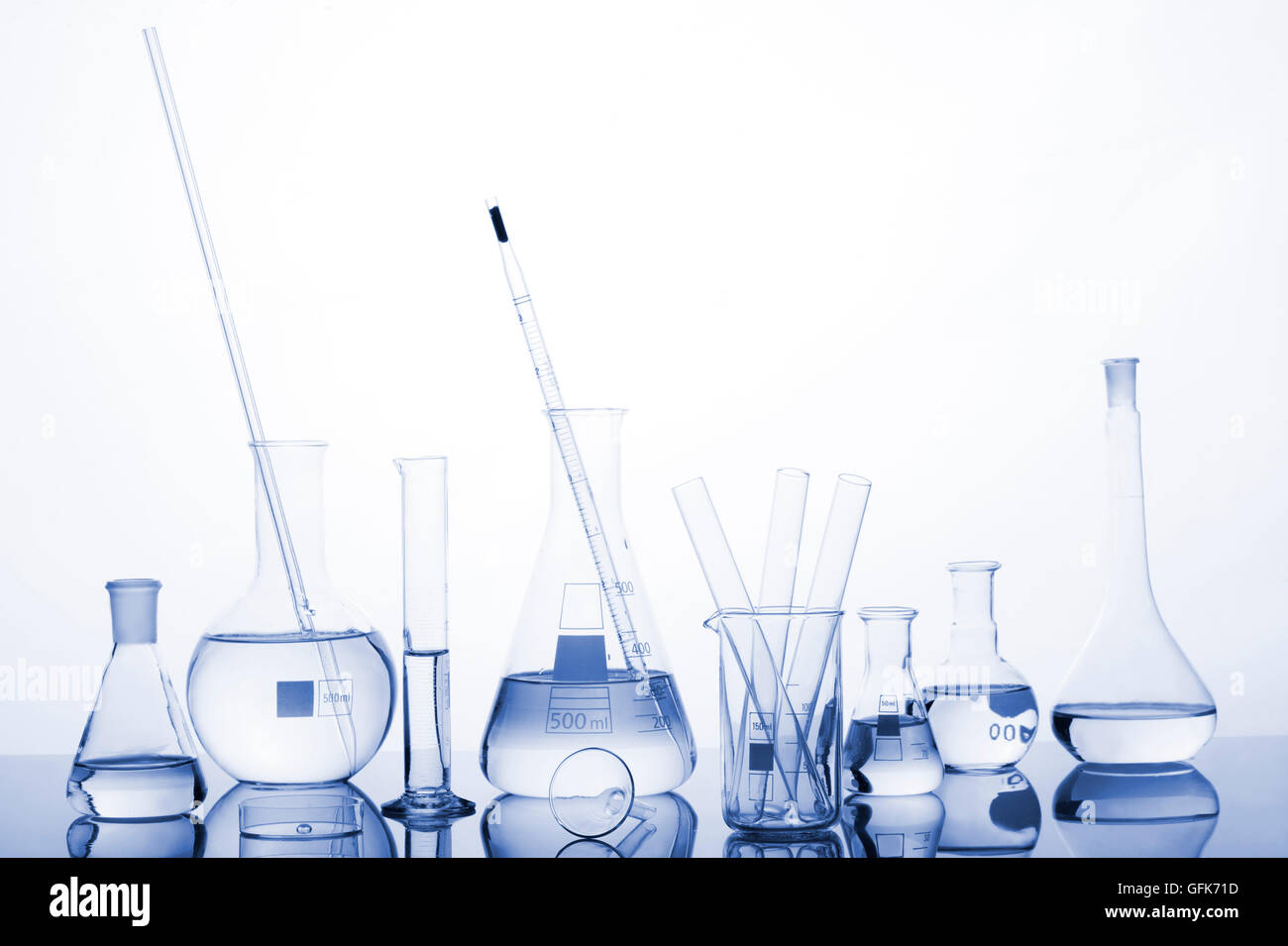 Test-tubes with reflections on a white and blue background. Laboratory ...