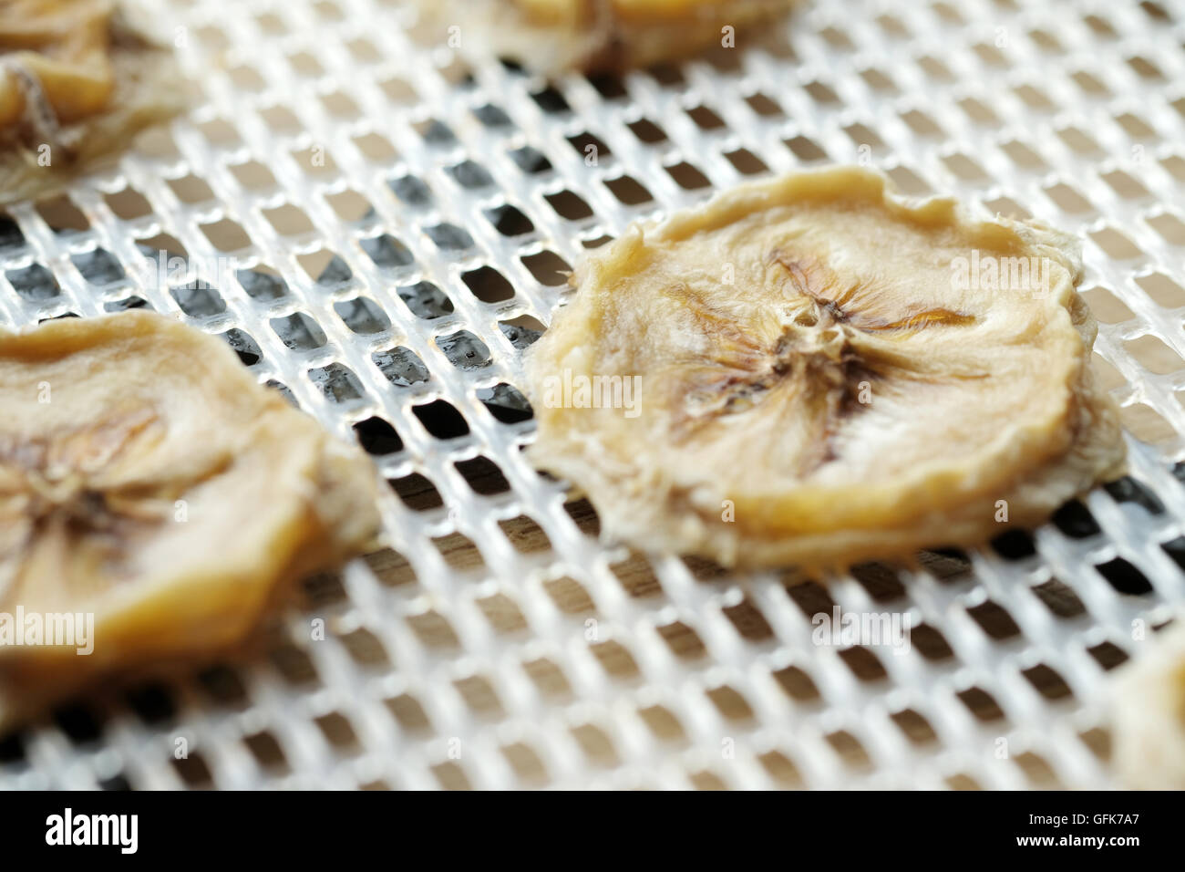 Dehydrated banana on a dehydrator rack having just finished the ...