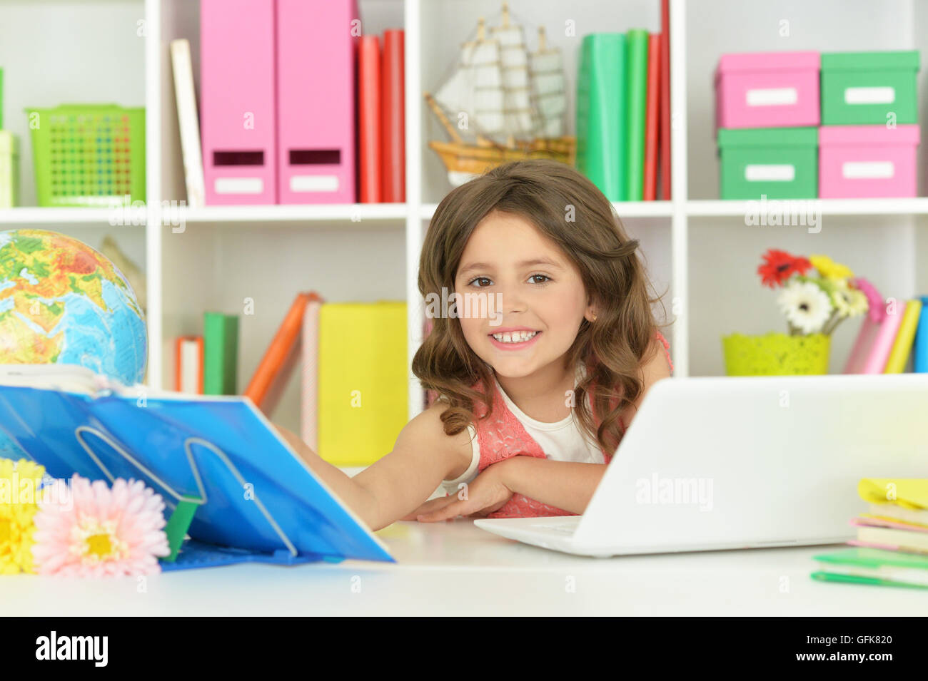 student girl with book and laptop Stock Photo - Alamy