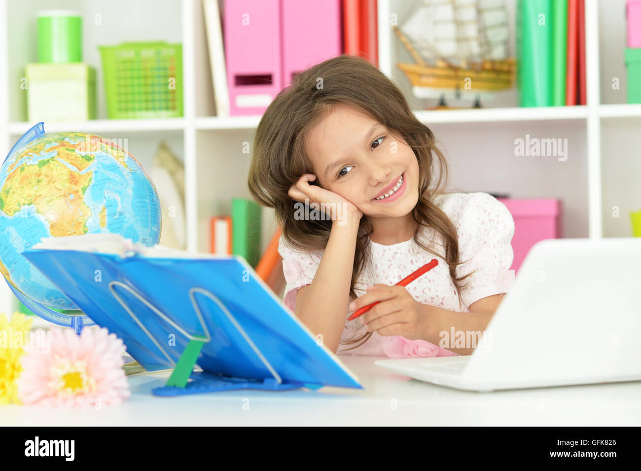 student girl with book and laptop Stock Photo - Alamy