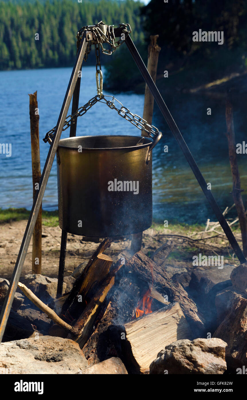 Camping fire on a lake shore Stock Photo - Alamy