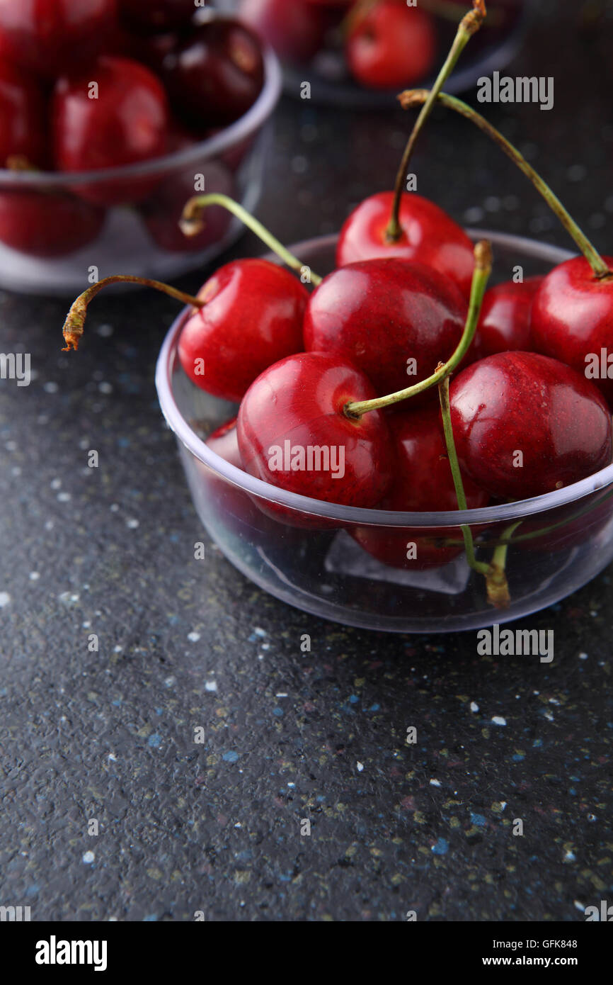bowl of cherries on dark background, food close-up Stock Photo - Alamy