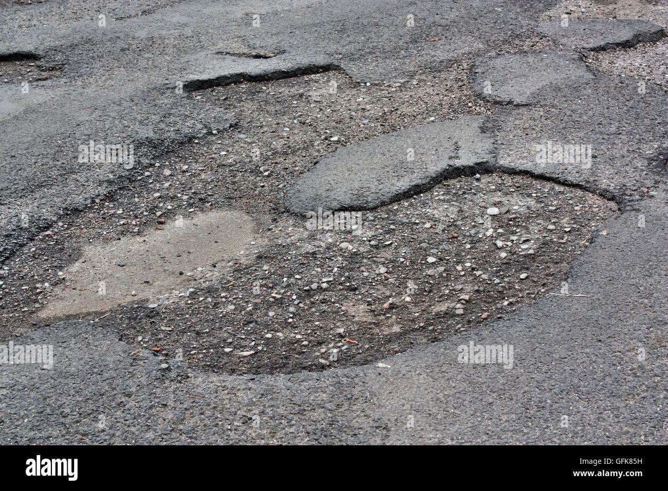 A large hole in the pavement asphalt gap Stock Photo - Alamy