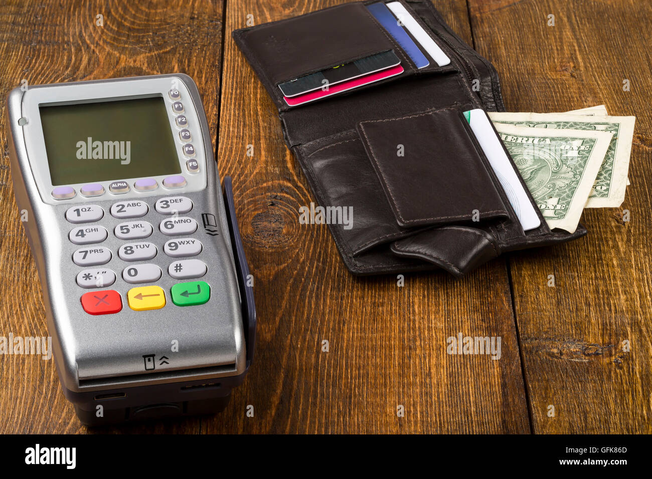 Payment wireless terminal and wallet with banknotes Stock Photo - Alamy