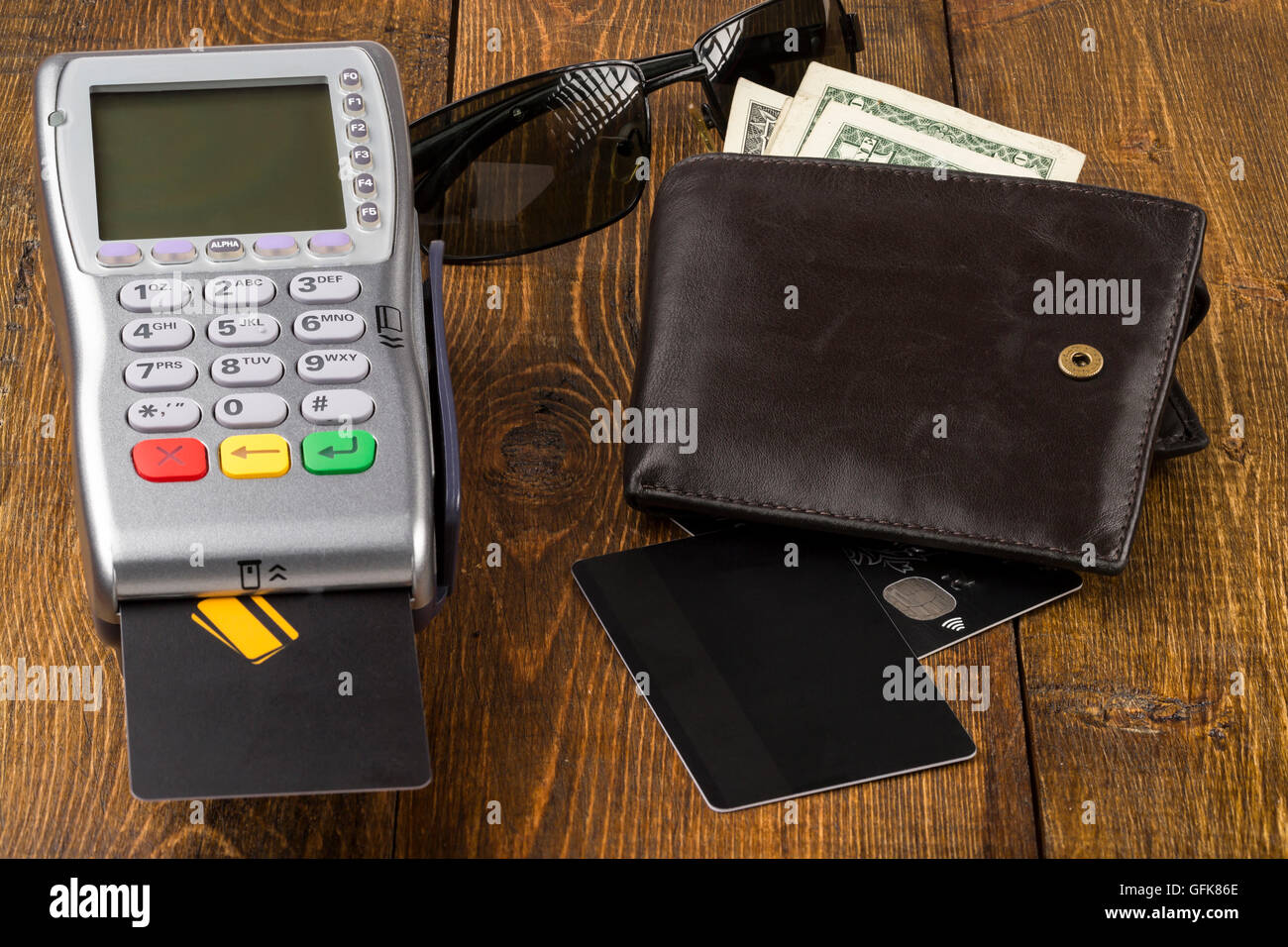Payment wireless terminal and wallet with banknotes Stock Photo - Alamy