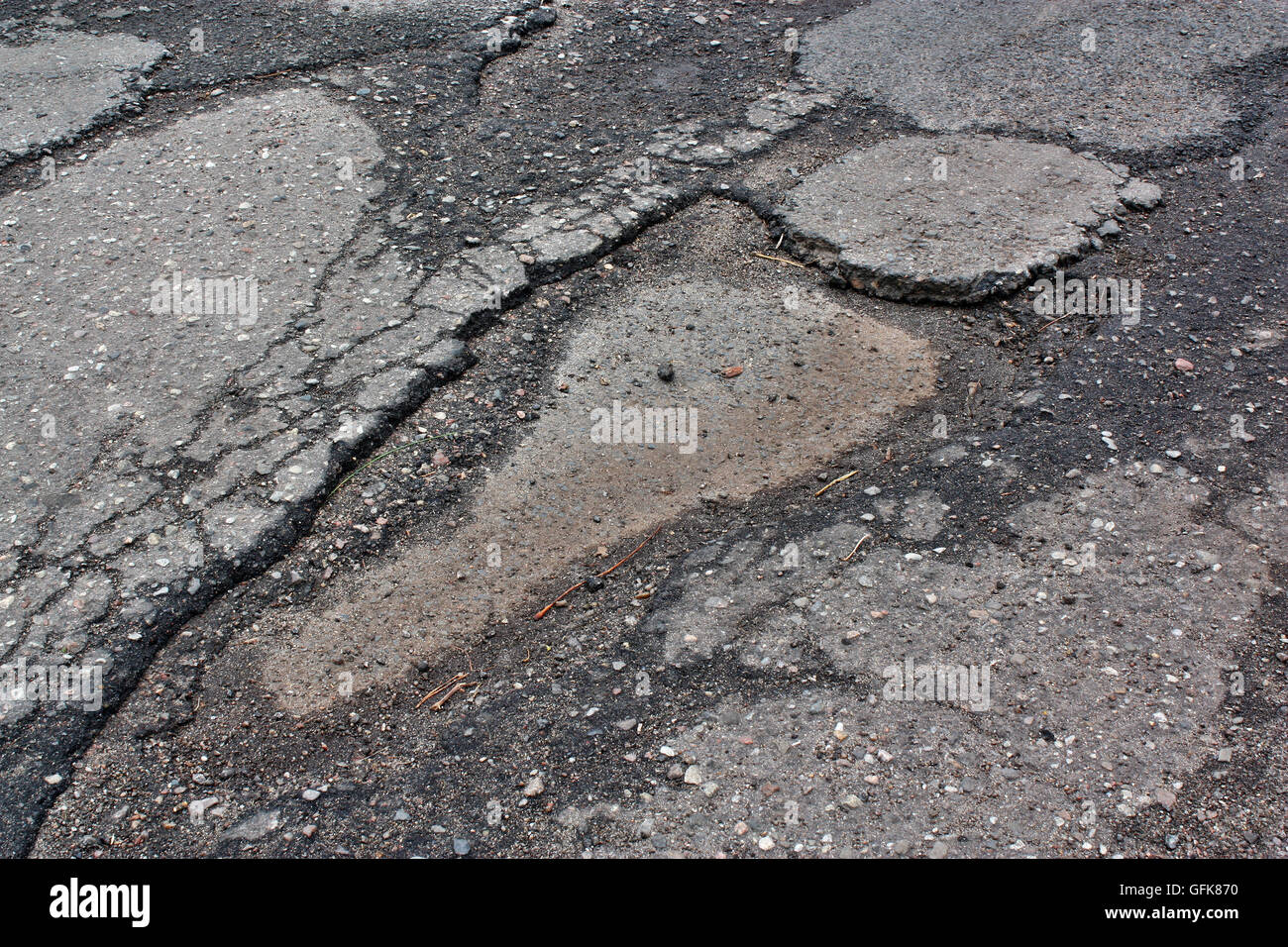 A large hole in the pavement asphalt gap Stock Photo - Alamy