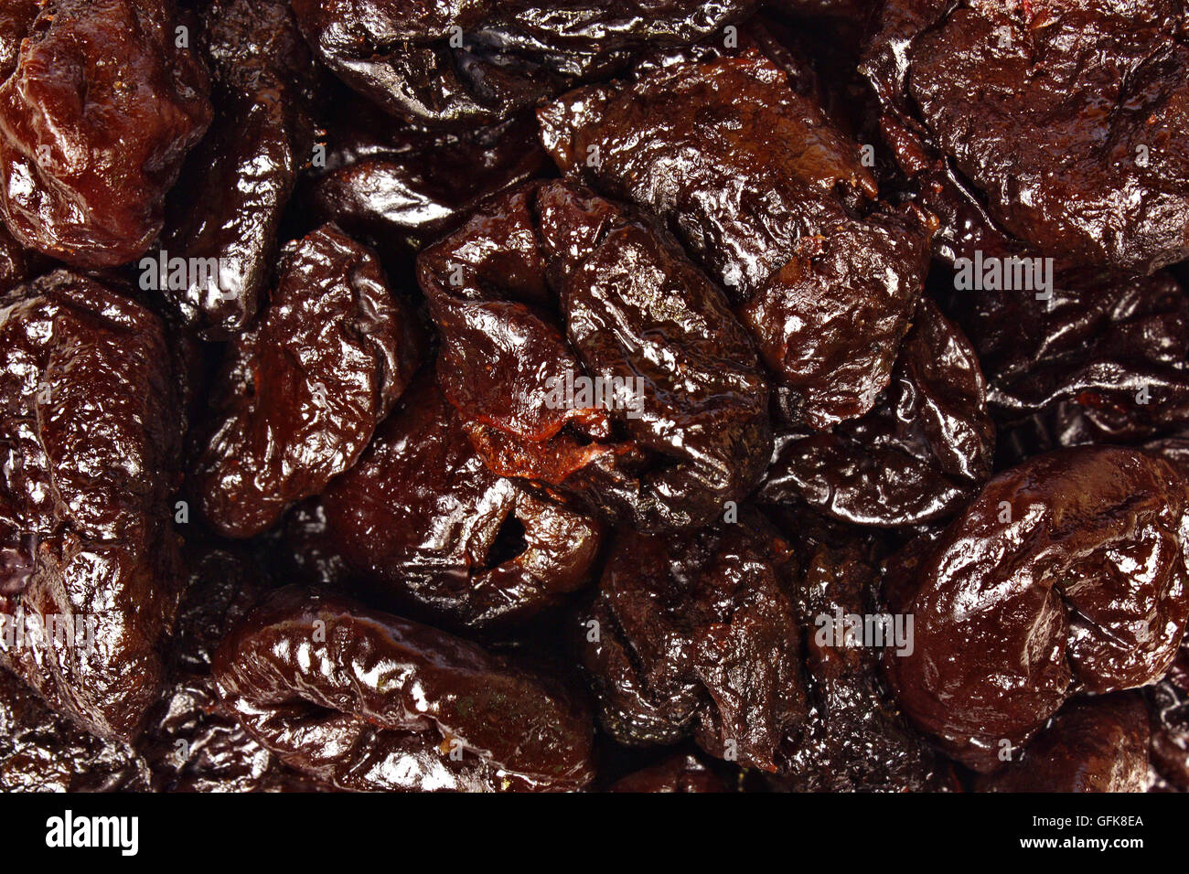 Dry plums or prunes fruit background Stock Photo - Alamy