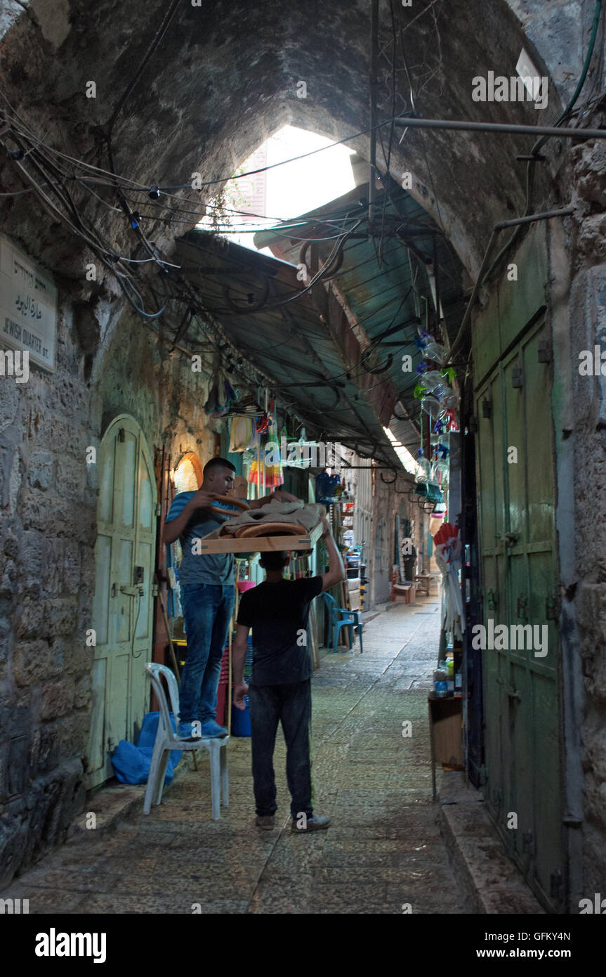 Jerusalem: people in the alleys of the Old City, a walled area in which ...