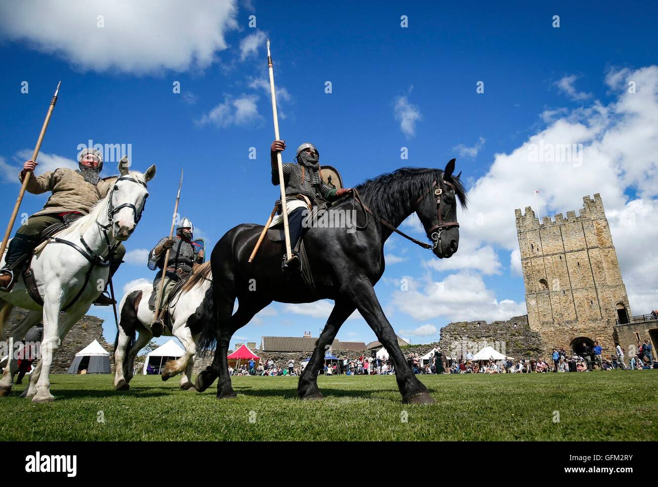 Norman and Saxon warriors take part in a mock battle to mark the 950th ...