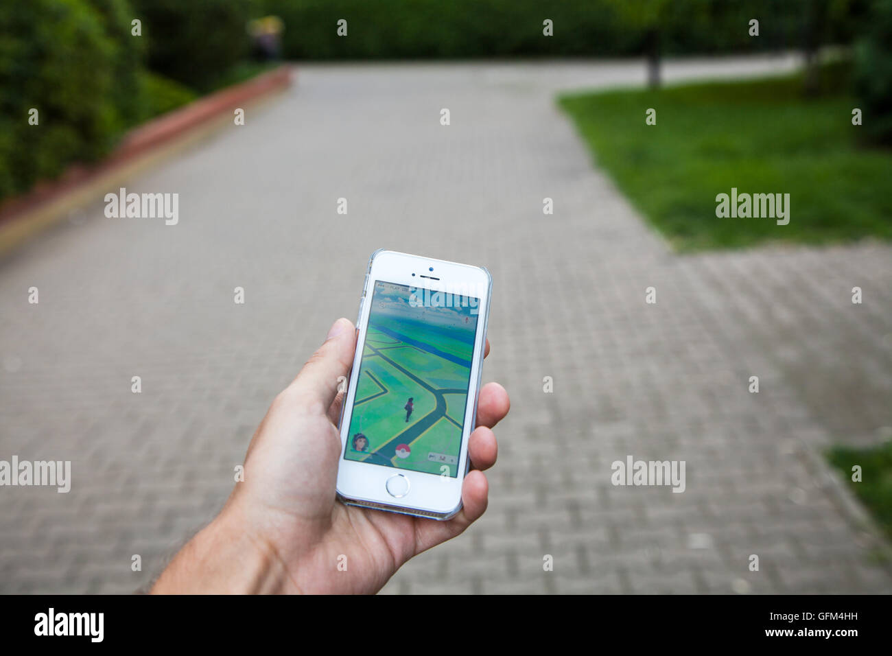 Pokemon Go game on screen of iPhone Stock Photo - Alamy