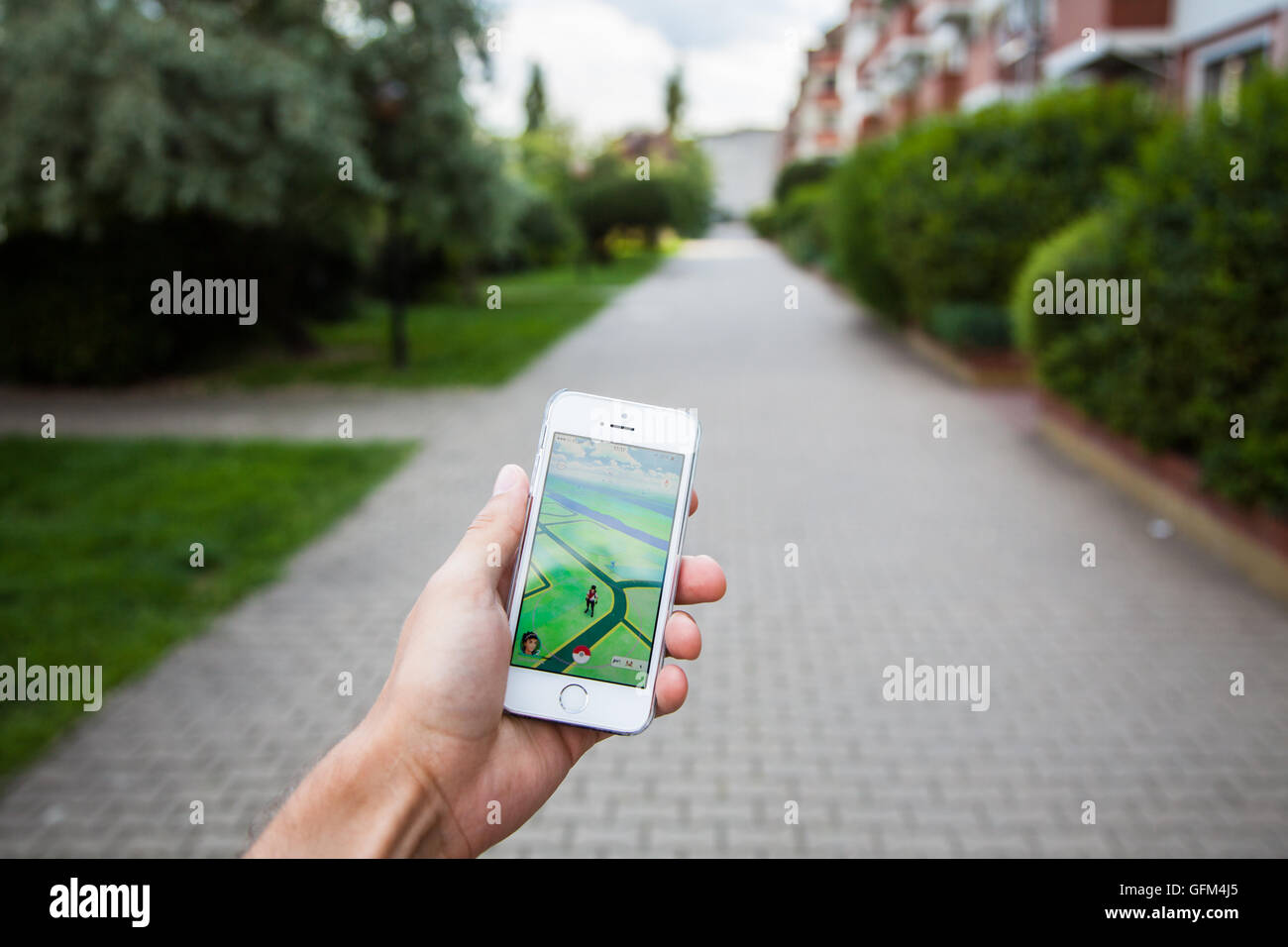 Pokemon Go game on screen of iPhone Stock Photo - Alamy