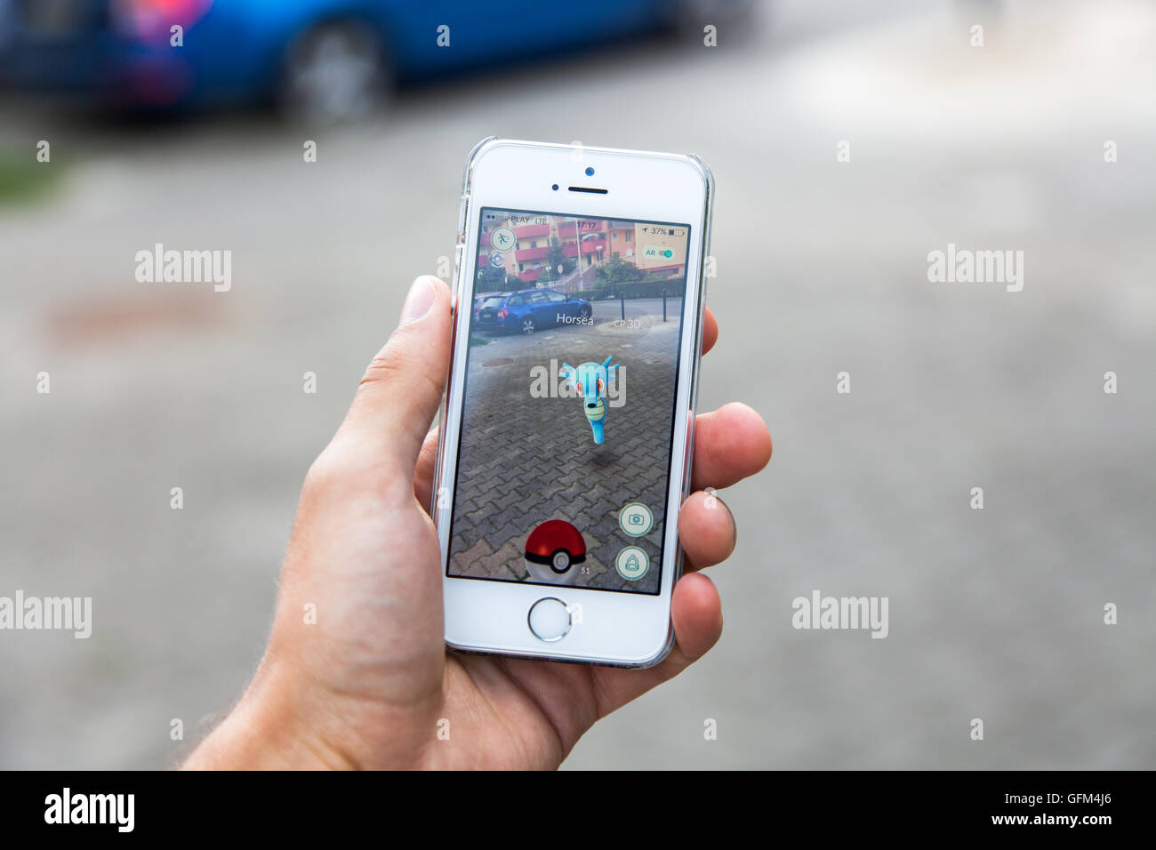 Pokemon Go game on screen of iPhone Stock Photo - Alamy