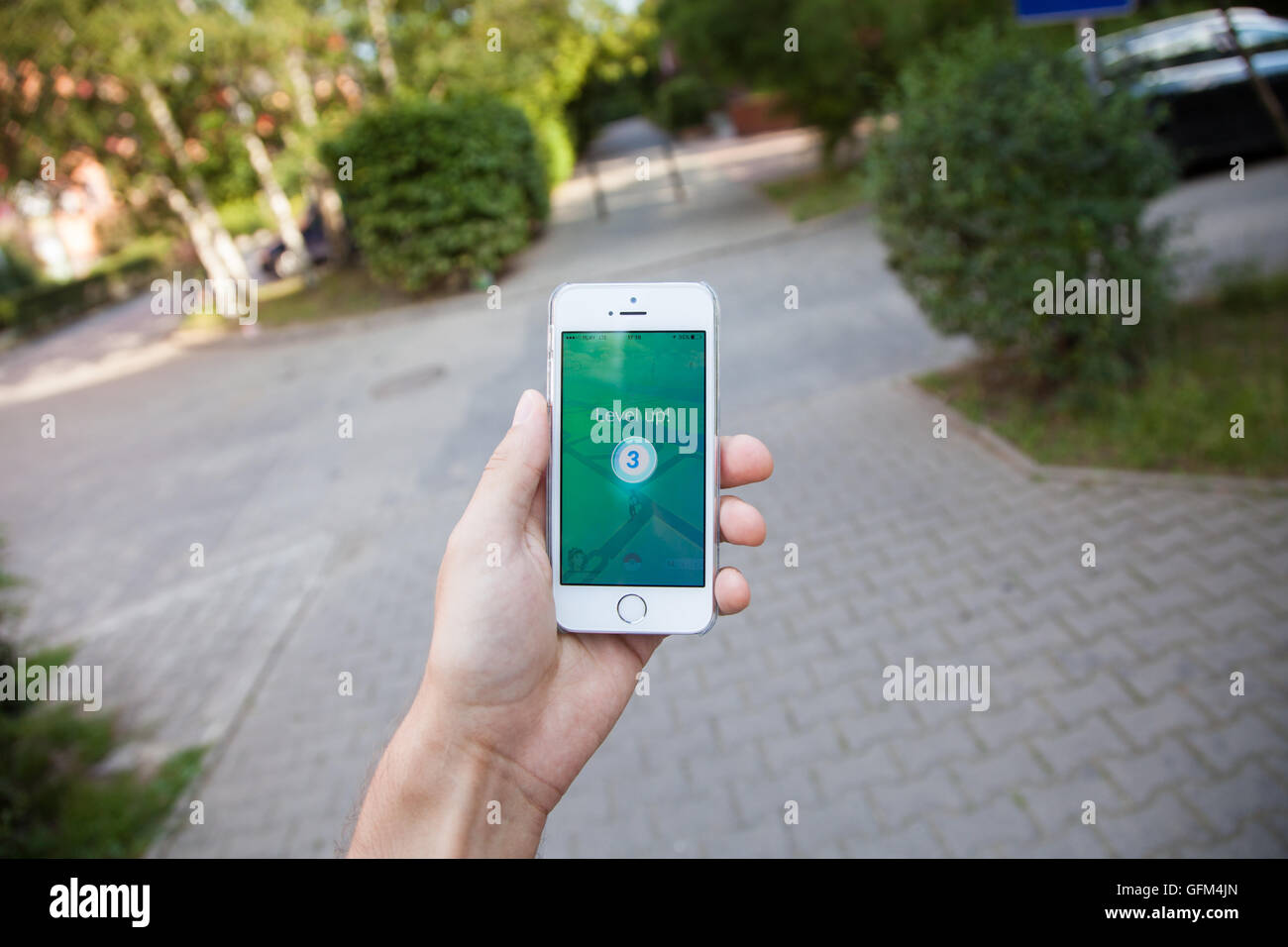 Pokemon Go game on screen of iPhone Stock Photo - Alamy