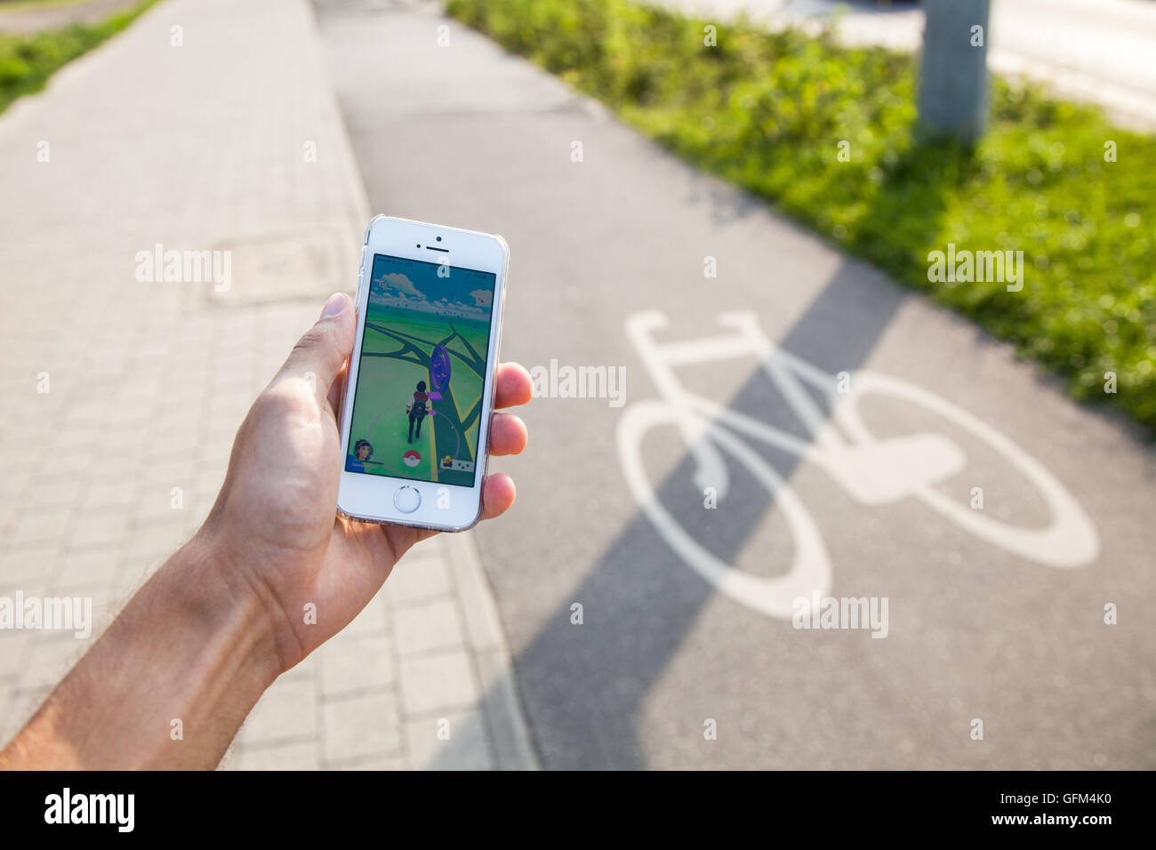 Pokemon Go game on screen of iPhone Stock Photo - Alamy