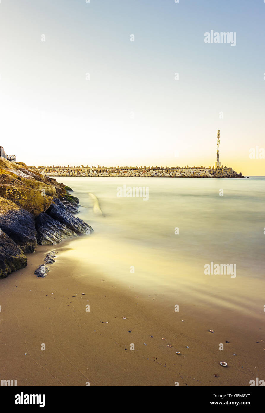 Sea landscape with a lighthouse in the port Stock Photo - Alamy