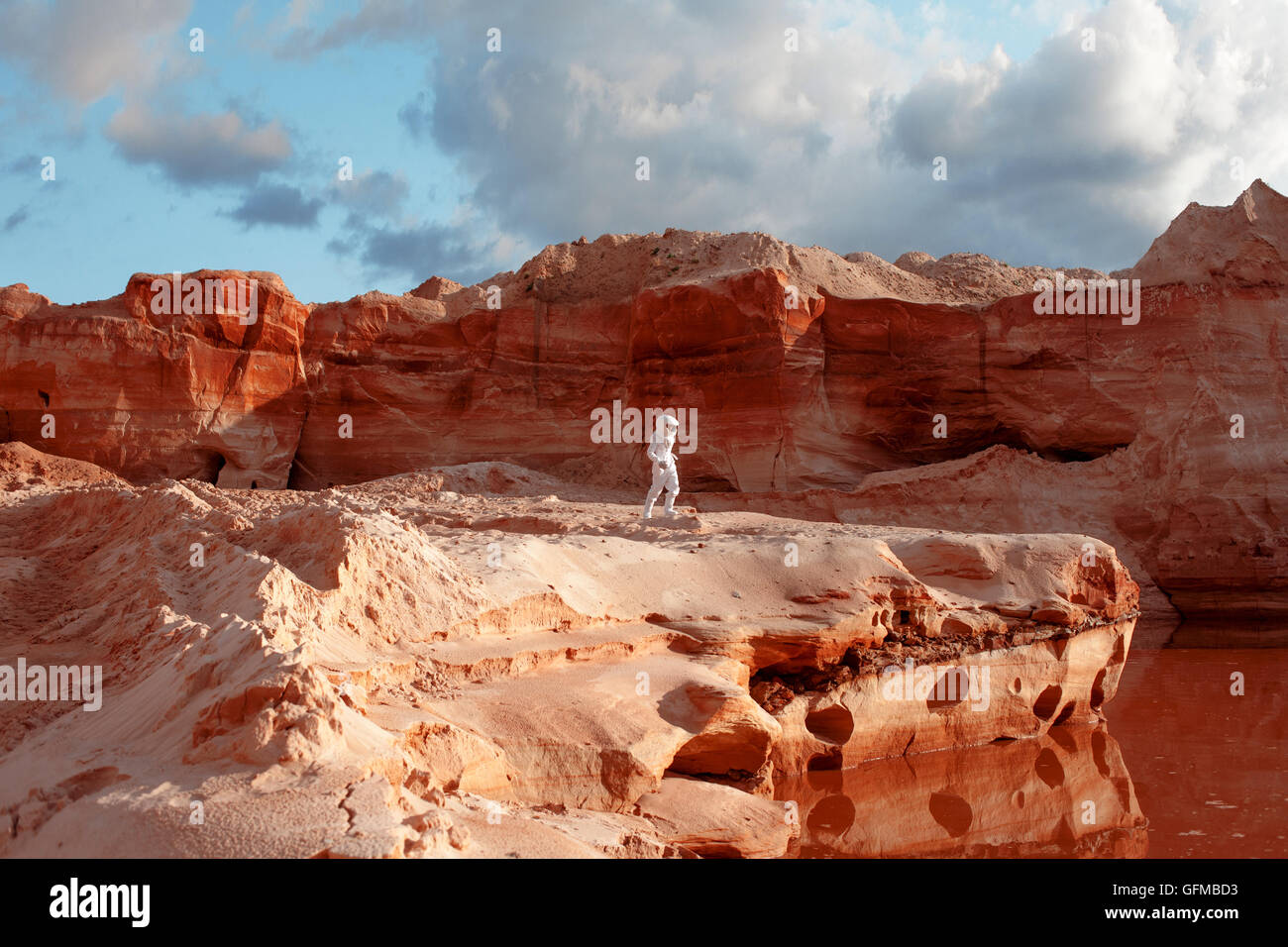 futuristic astronaut on another planet, sandy red planet Stock Photo ...