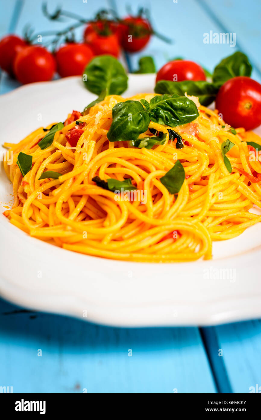Traditional italian cuisine spaghetti with tomato sauce, basil and ...