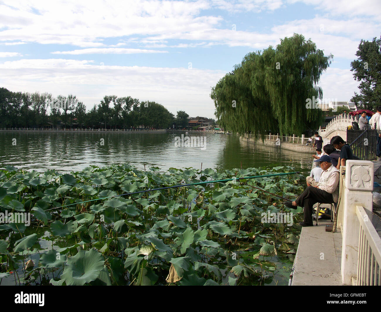 Fisherman on Xi Hai Lake in Beijing, China. The Back Lakes Stock Photo ...