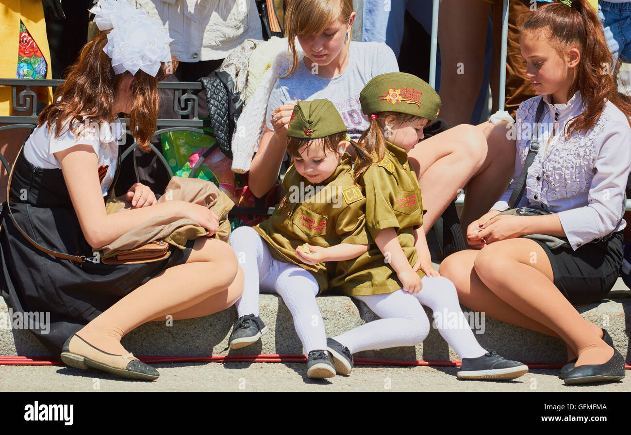 Two small girls in military uniform at the 9th May Victory Day parade ...