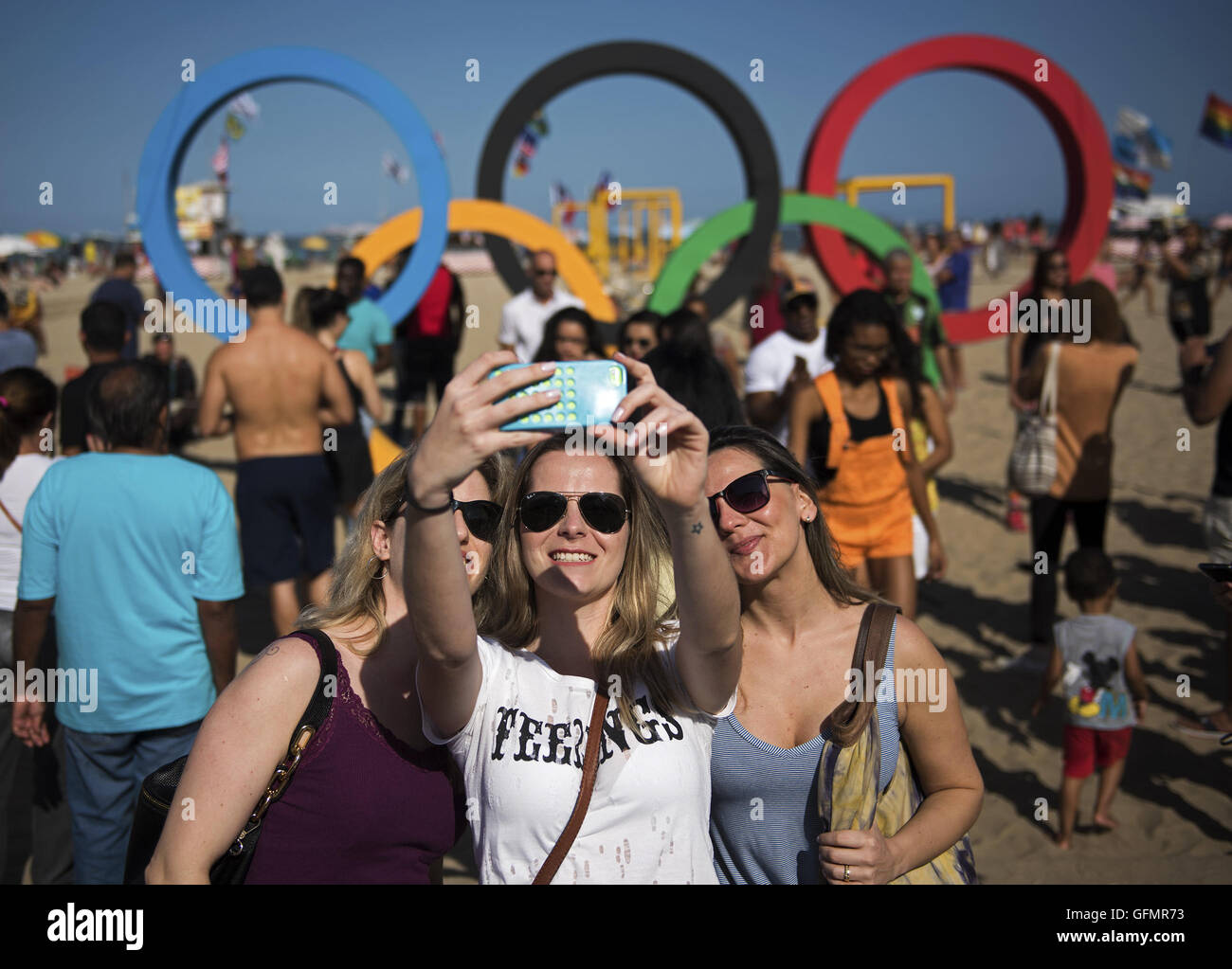 Rio De Janeiro, Brazil. 31st July, 2016. People pose for photos with ...