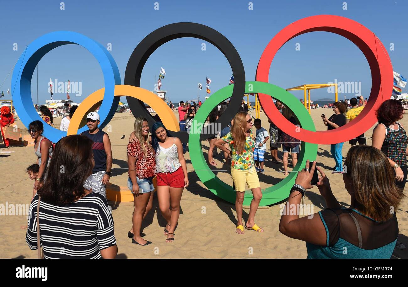 Rio De Janeiro, Sunday. 31st July, 2016. People pose for photos with ...