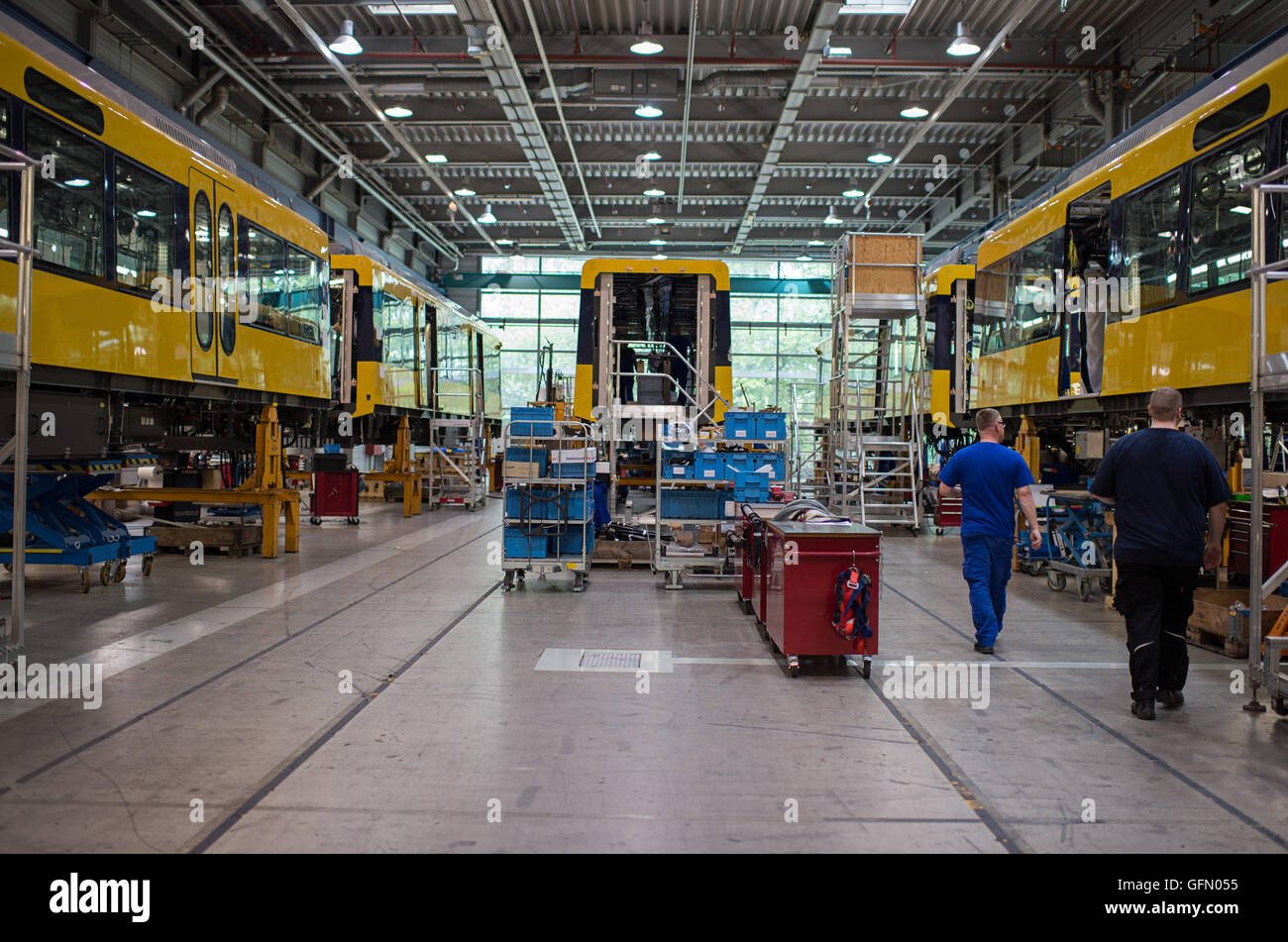 Berlin, Germany. 19th July, 2016. Workers assembling a tram at a ...