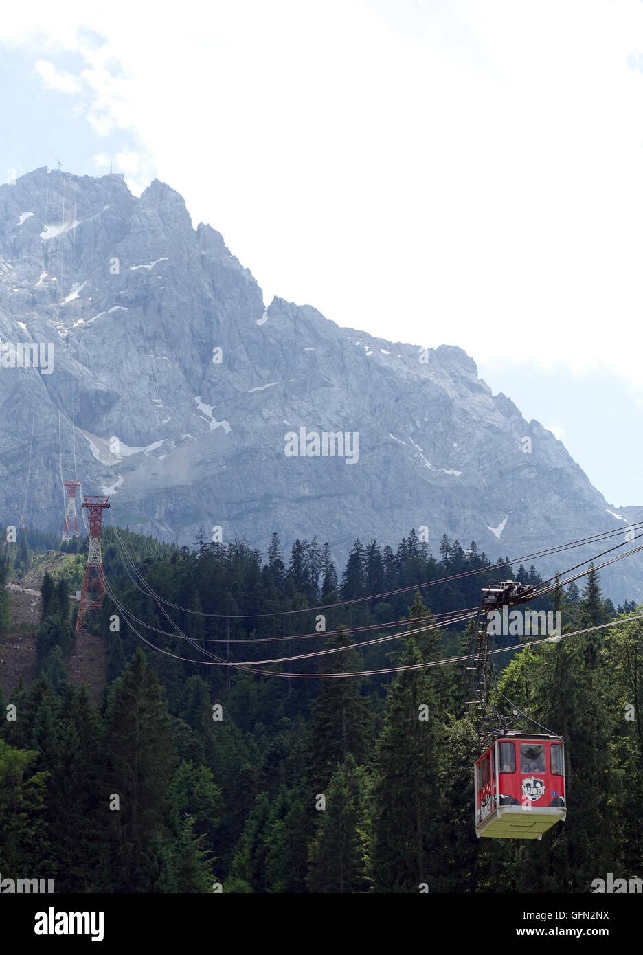 A carriage of the Eibsee cable car rides to the valley station at ...
