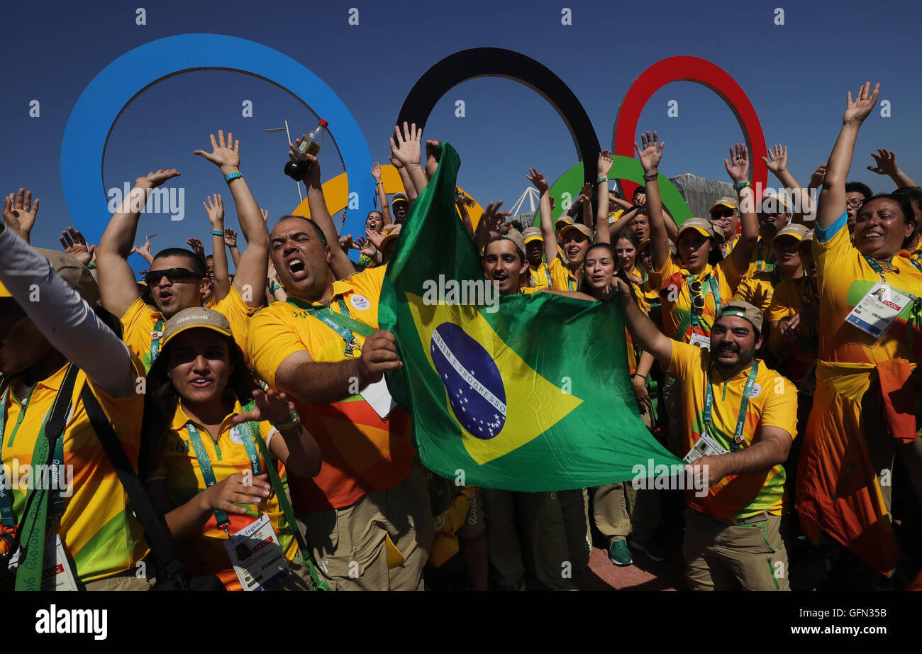 Rio de Janeiro, Brazil. 1st Aug, 2016. Volunteers cheer in front of the ...