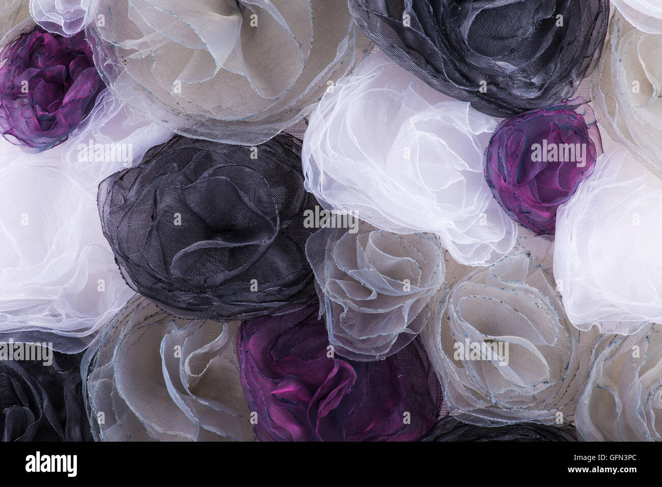 Background of different colors of cloth flowers Stock Photo - Alamy