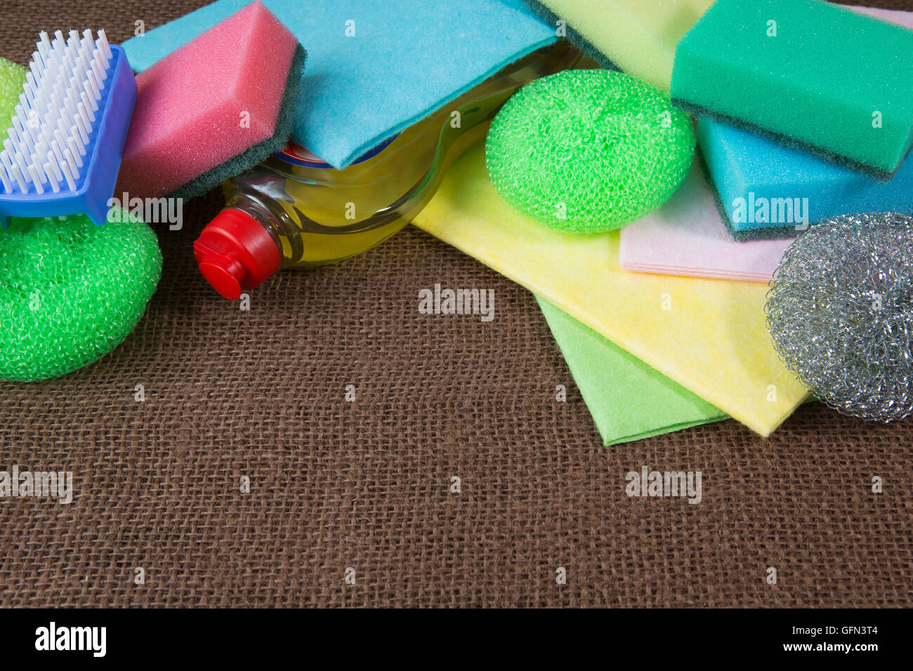 Container with liquid for glass, wipes, colorful sponges for washing ...