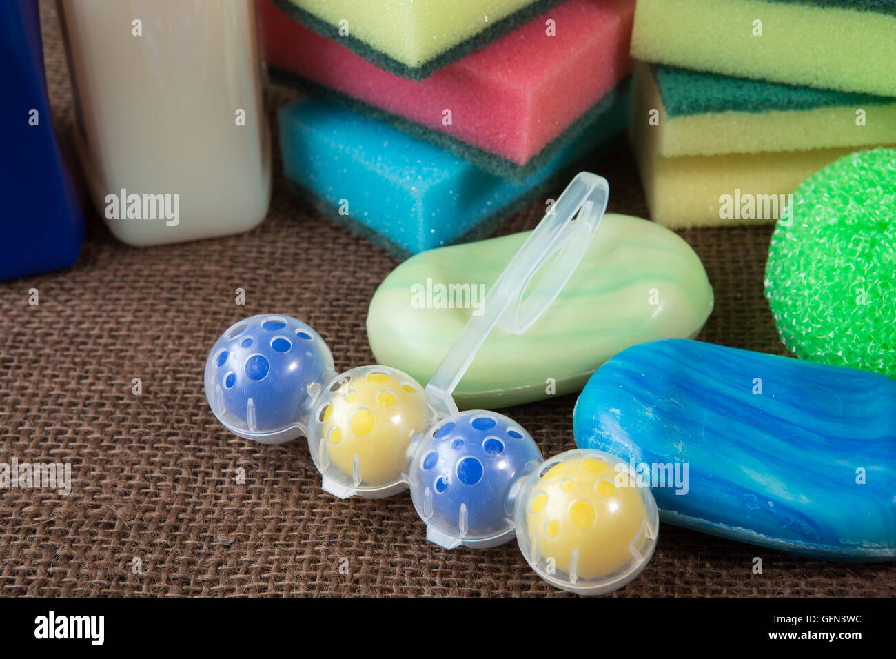 Container with liquid for glass, wipes, colorful sponges for washing ...
