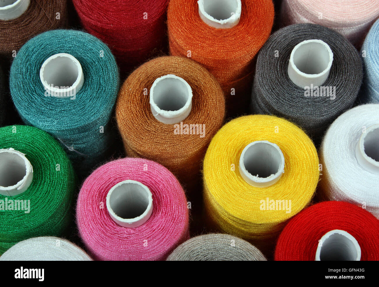 Colorful reels of threads background Stock Photo - Alamy