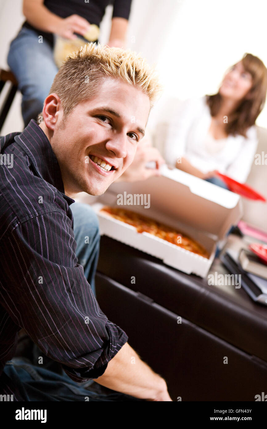 Group of friends, hanging out, eating pizza and studying Stock Photo ...