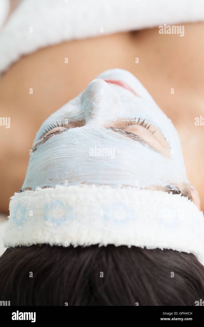 Facial mask application on young female patient Stock Photo - Alamy